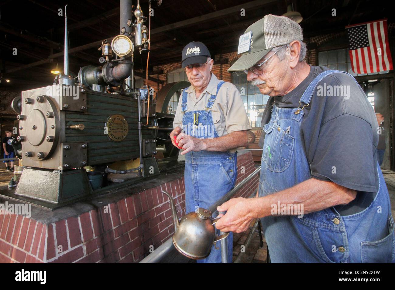 Walter Clement, left, and Duncan Metcalf prepare to oil one of the ...