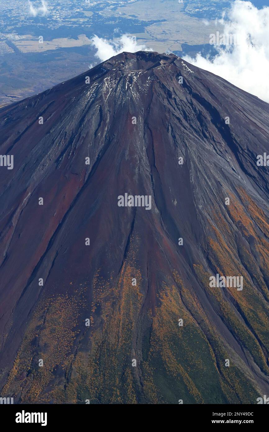 Aerial photo shows Mt. Fuji snow-capped slightly for the first time in ...