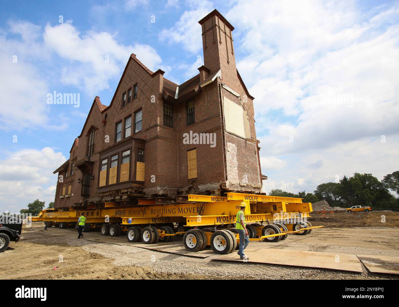 In this Aug. 28, 2017 photo, crews from Wolfe House & Building Movers ...