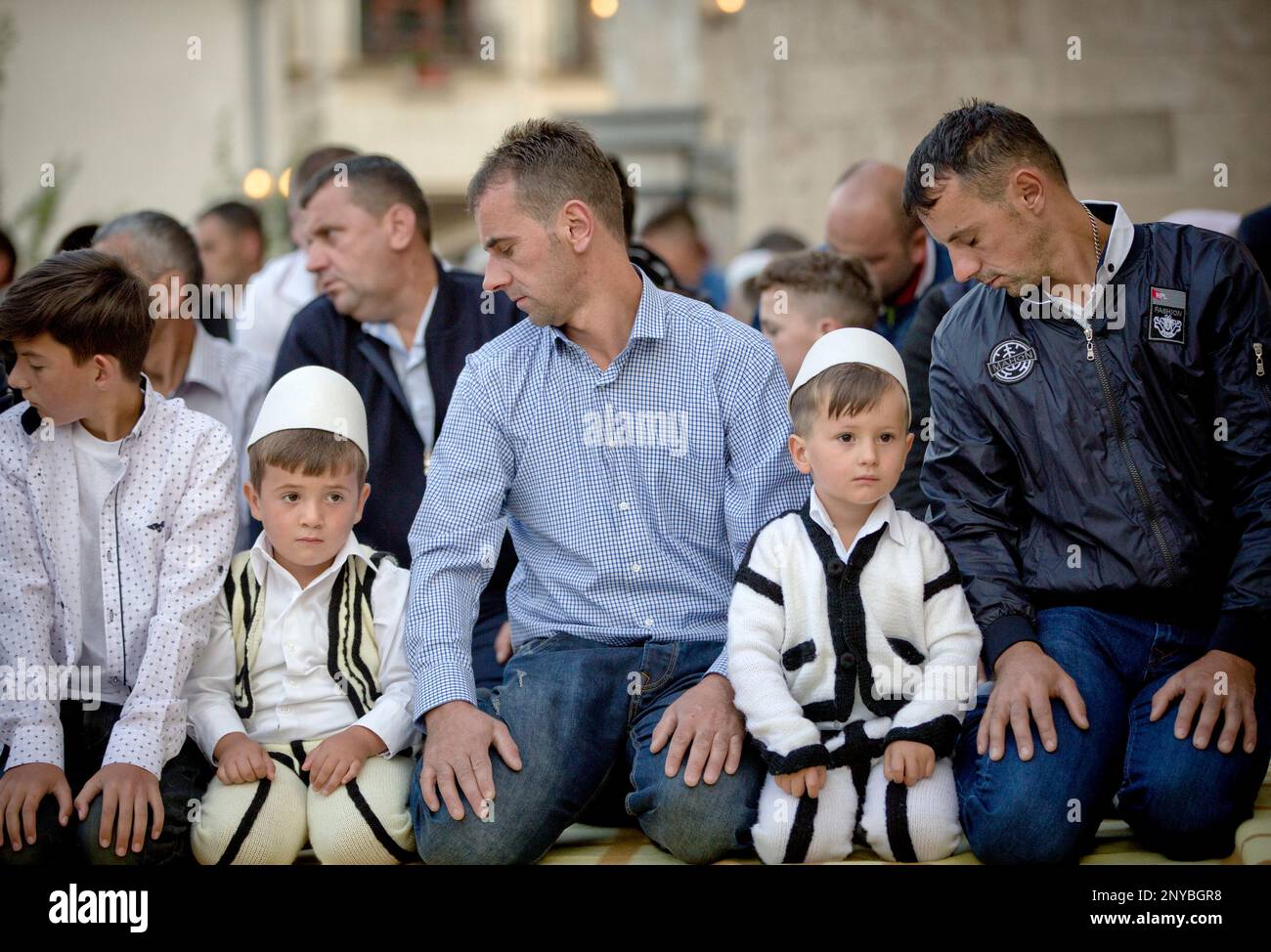 Kosovar children wearing traditional Albanian outfits attend Eid al-Adha prayers outside Sultan ...