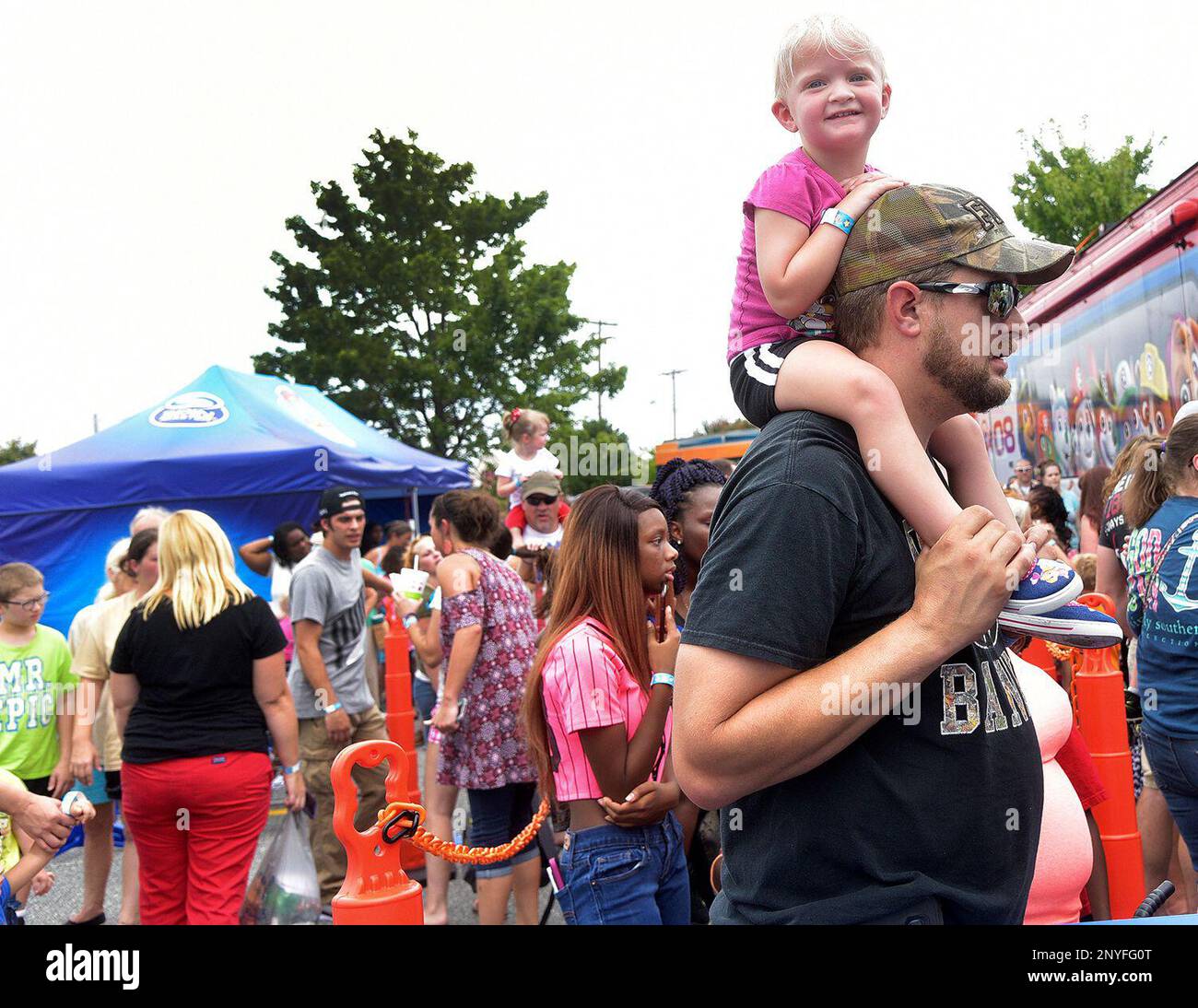 In this Friday, July 28, 2017 photo, Emma Kendrick rides on her dad's ...