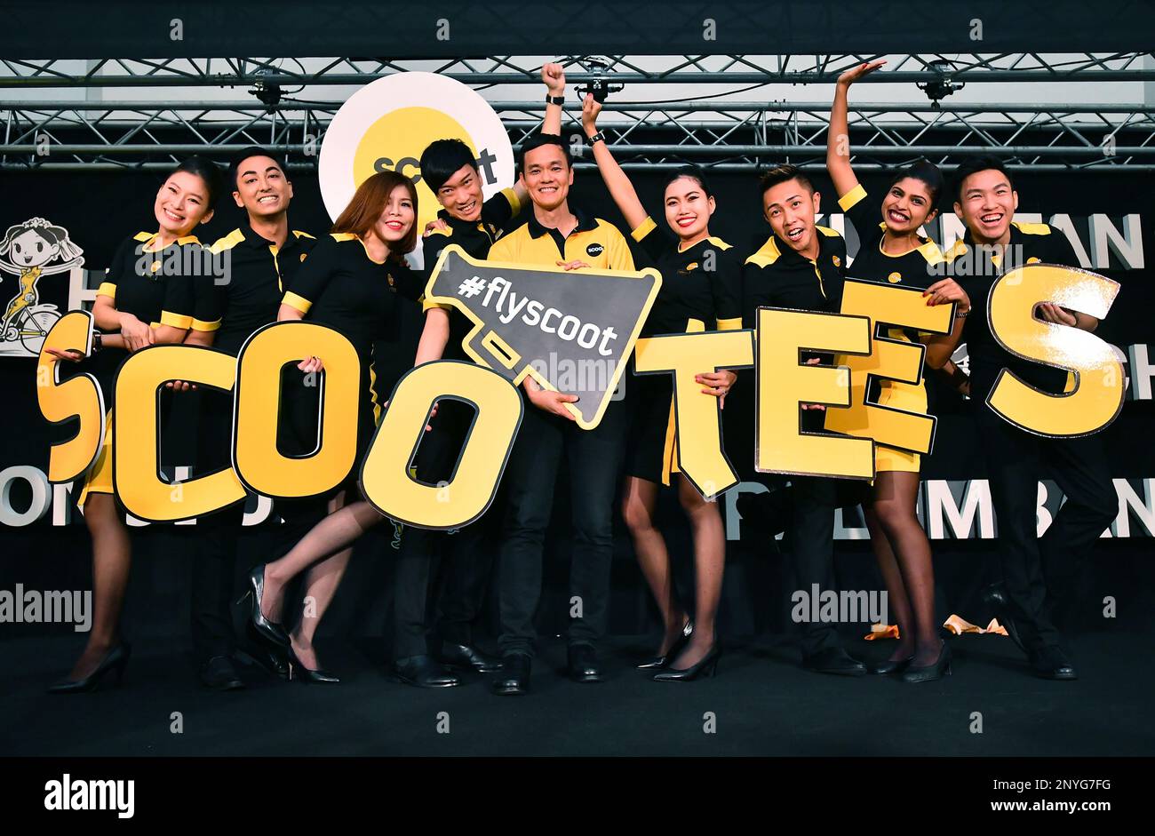 Scoot's chief executive officer Lee Lik Hsin (middle), together with ...