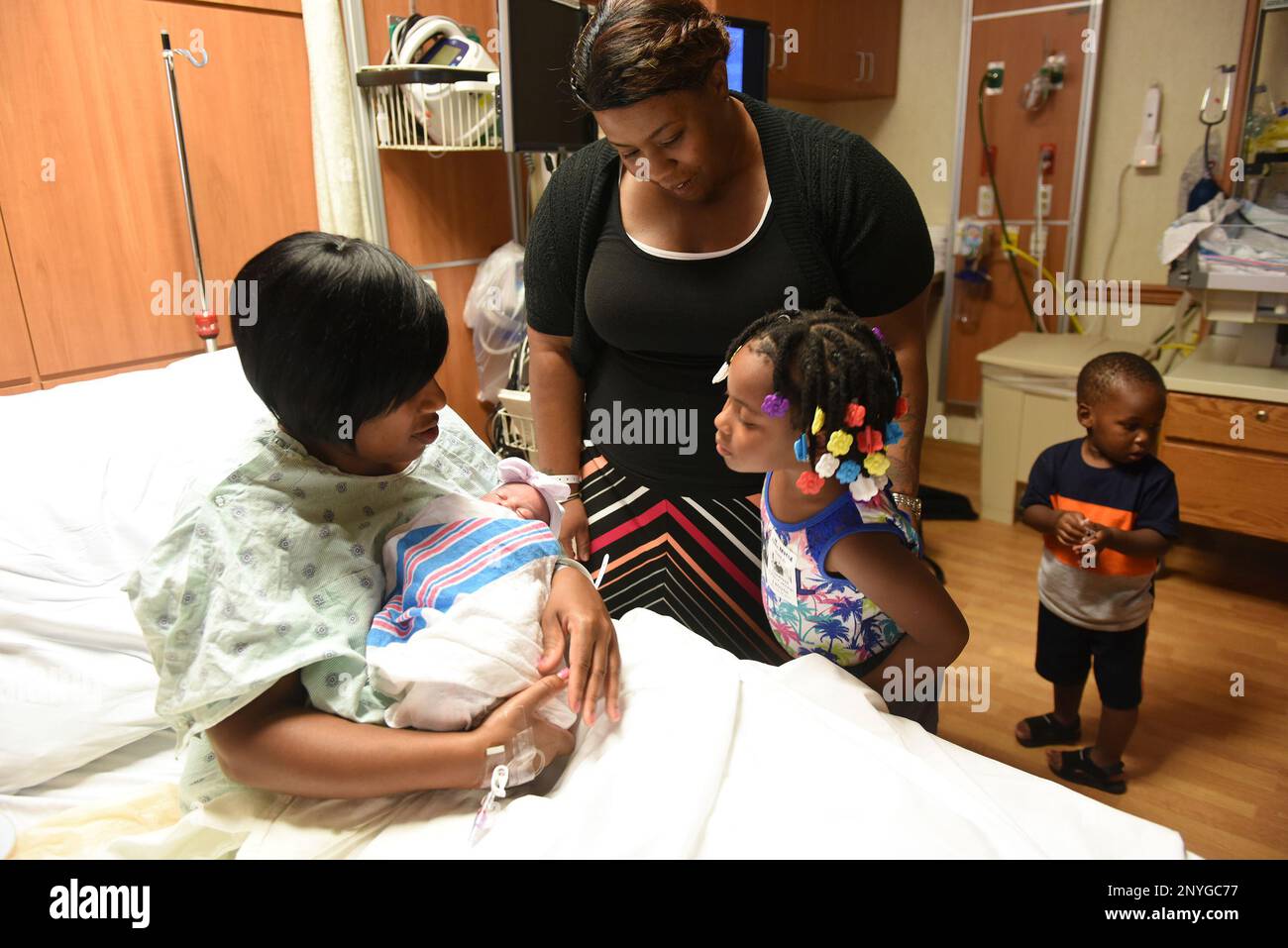 Ro-Zahriyah Brown, 4, leans in to get a better look at her new baby ...