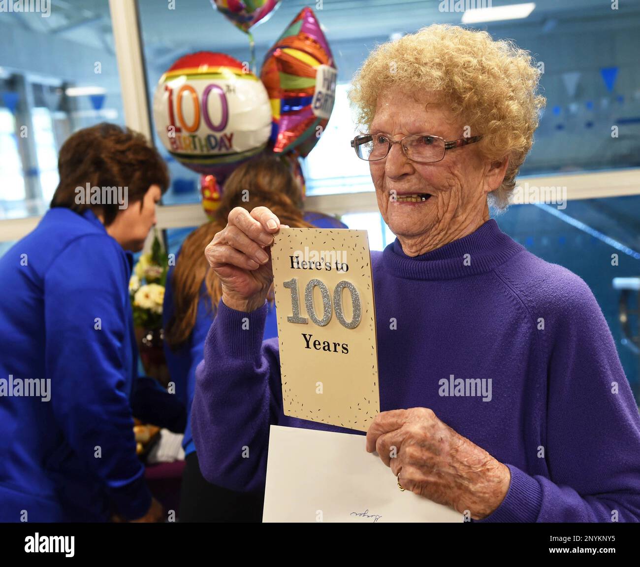 Virginia Milbert posed with a birthday card as she celebrated her 100th ...