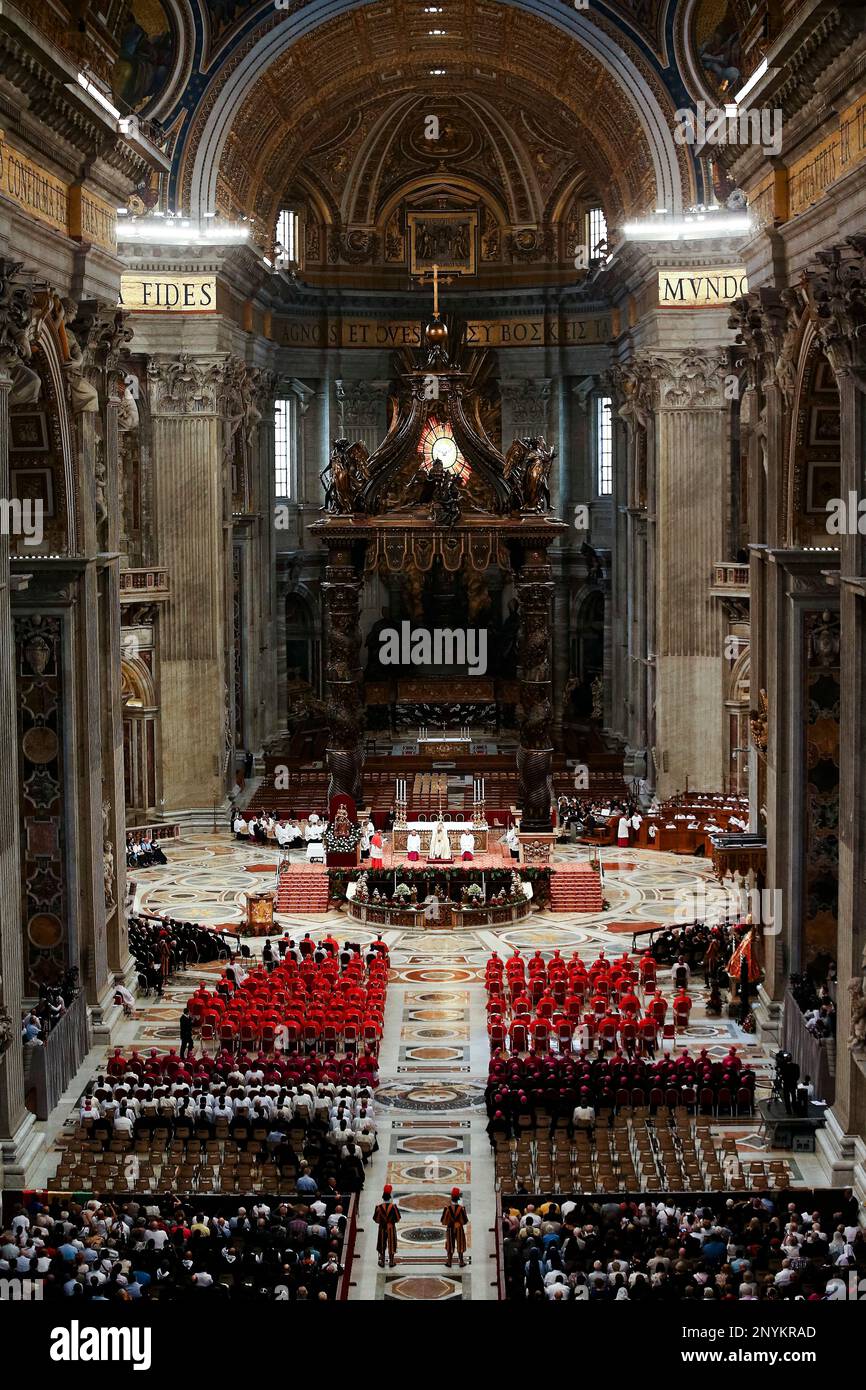 Pope Francis sits on the altar in St. Peter's Basilica to celebrate a ...