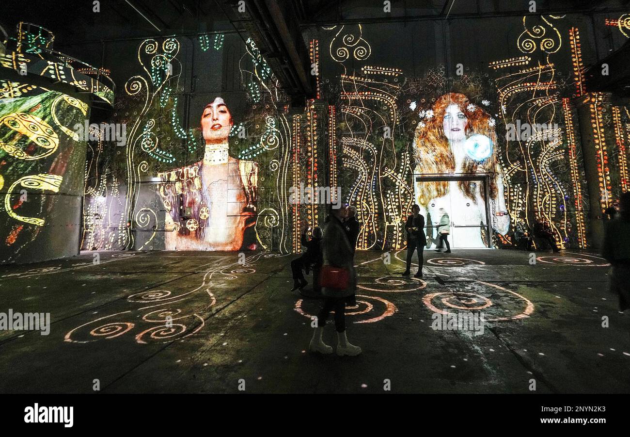 Visitors watch digital illuminated multimedia artworks by Austrian ...