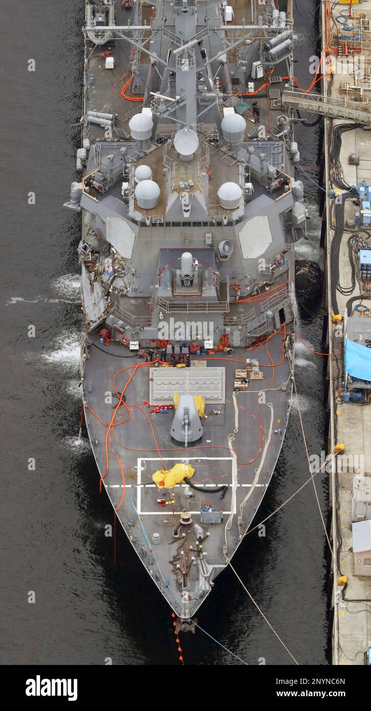 This aerial photo shows the USS Fitzgerald (8,315t), damaged by the ...