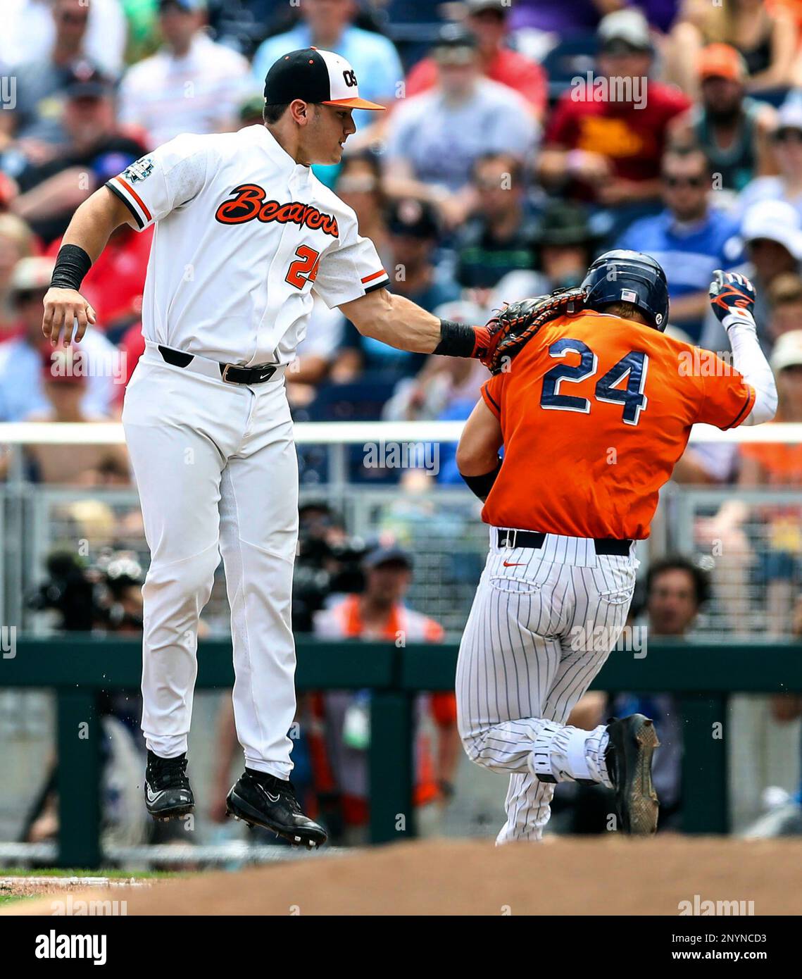 Oregon State's KJ Harrison, left, tags out Cal State Fullerton's Chris ...