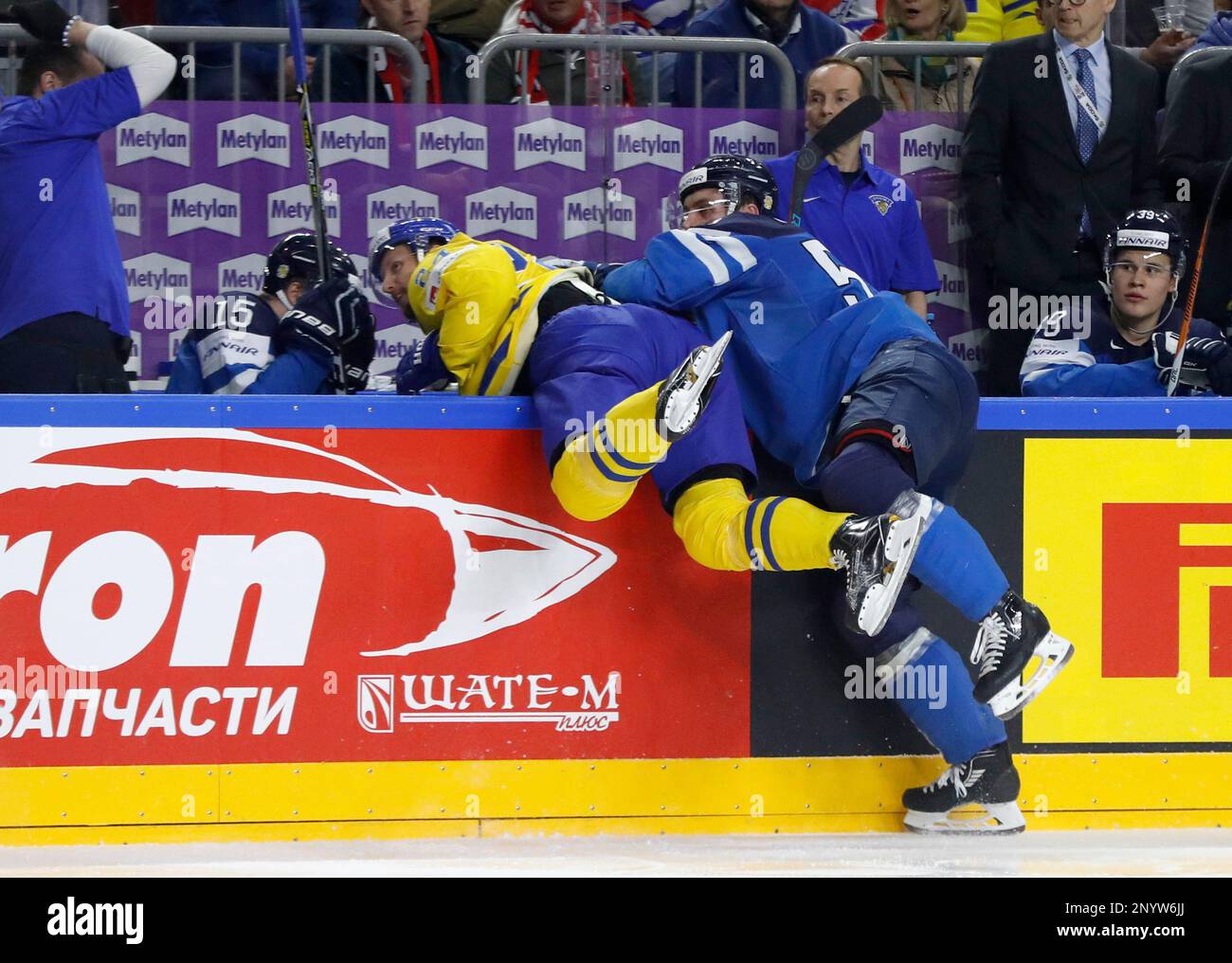 Finland's Atte Ohtamaa, right, checks Sweden's Alexander Edler at the ...
