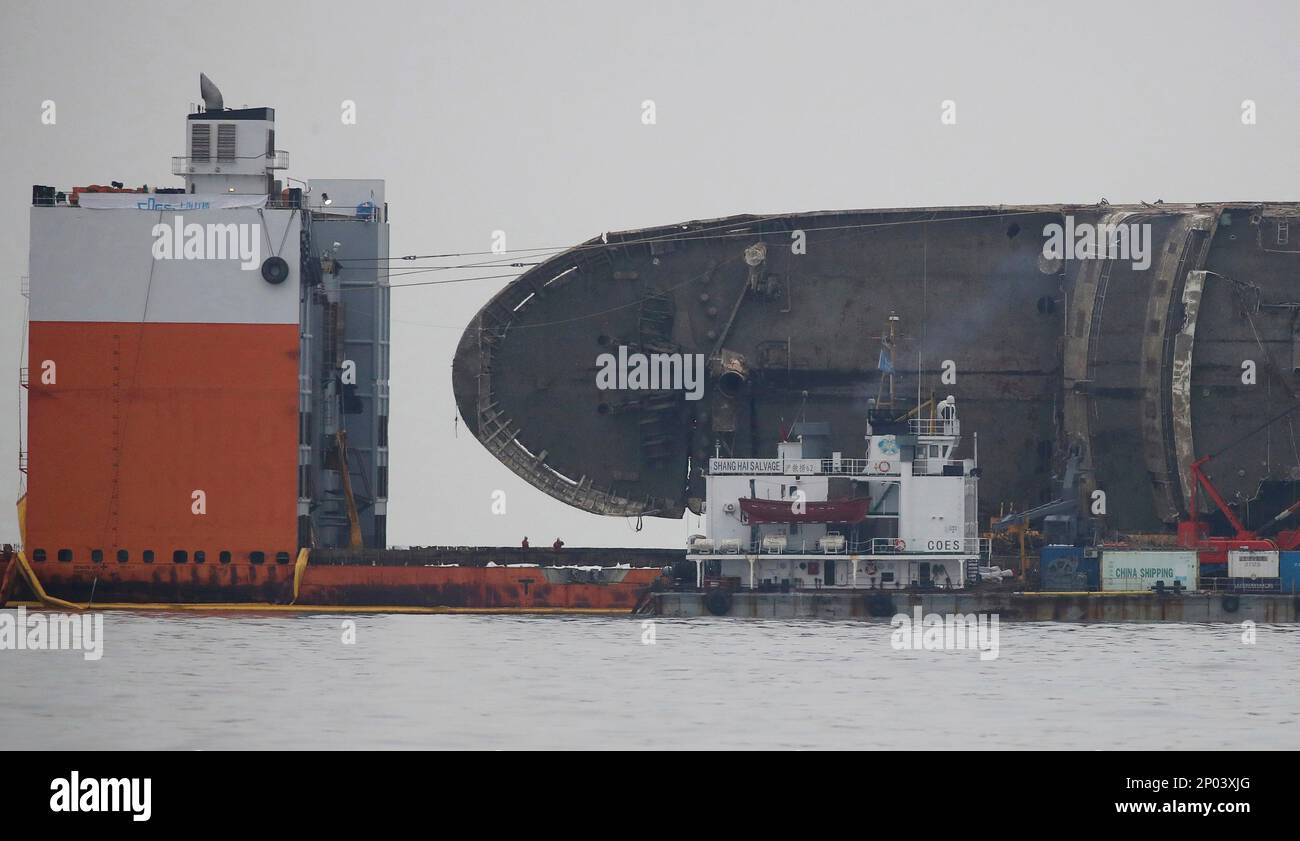 A part of the sunken ferry Sewol is seen on a semi-submersible ...