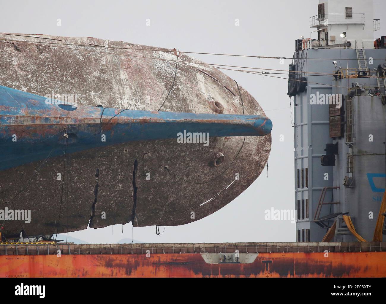 A part of the sunken ferry Sewol is seen on a semi-submersible ...