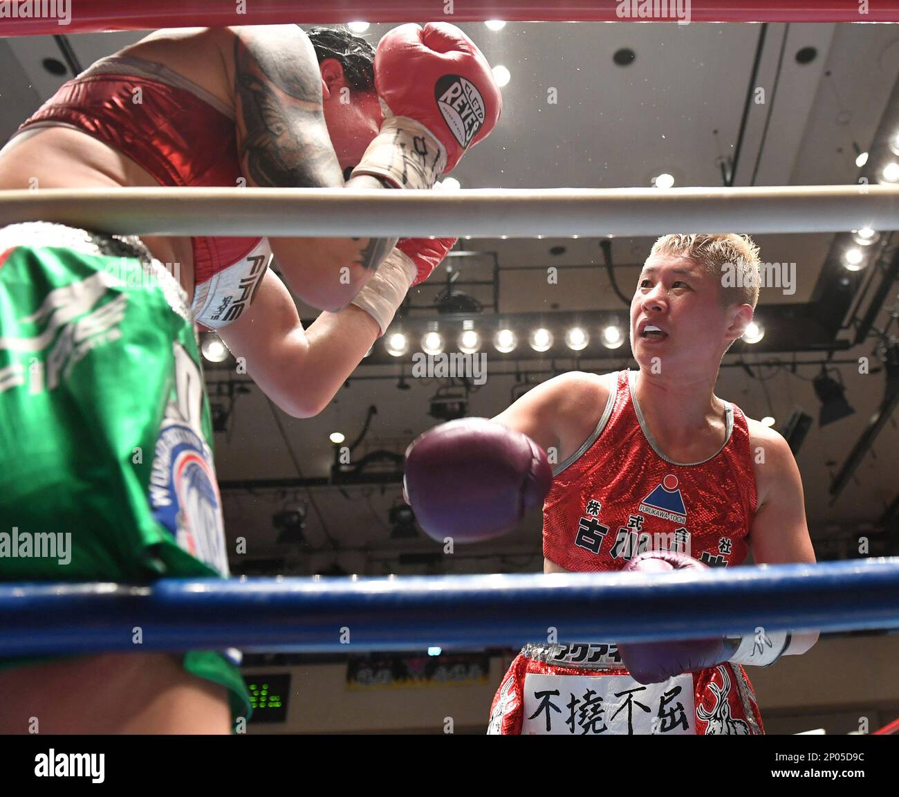 Japan's Naoko Fujioka (R) lands a punch against Mexico's Isabel Millan ...