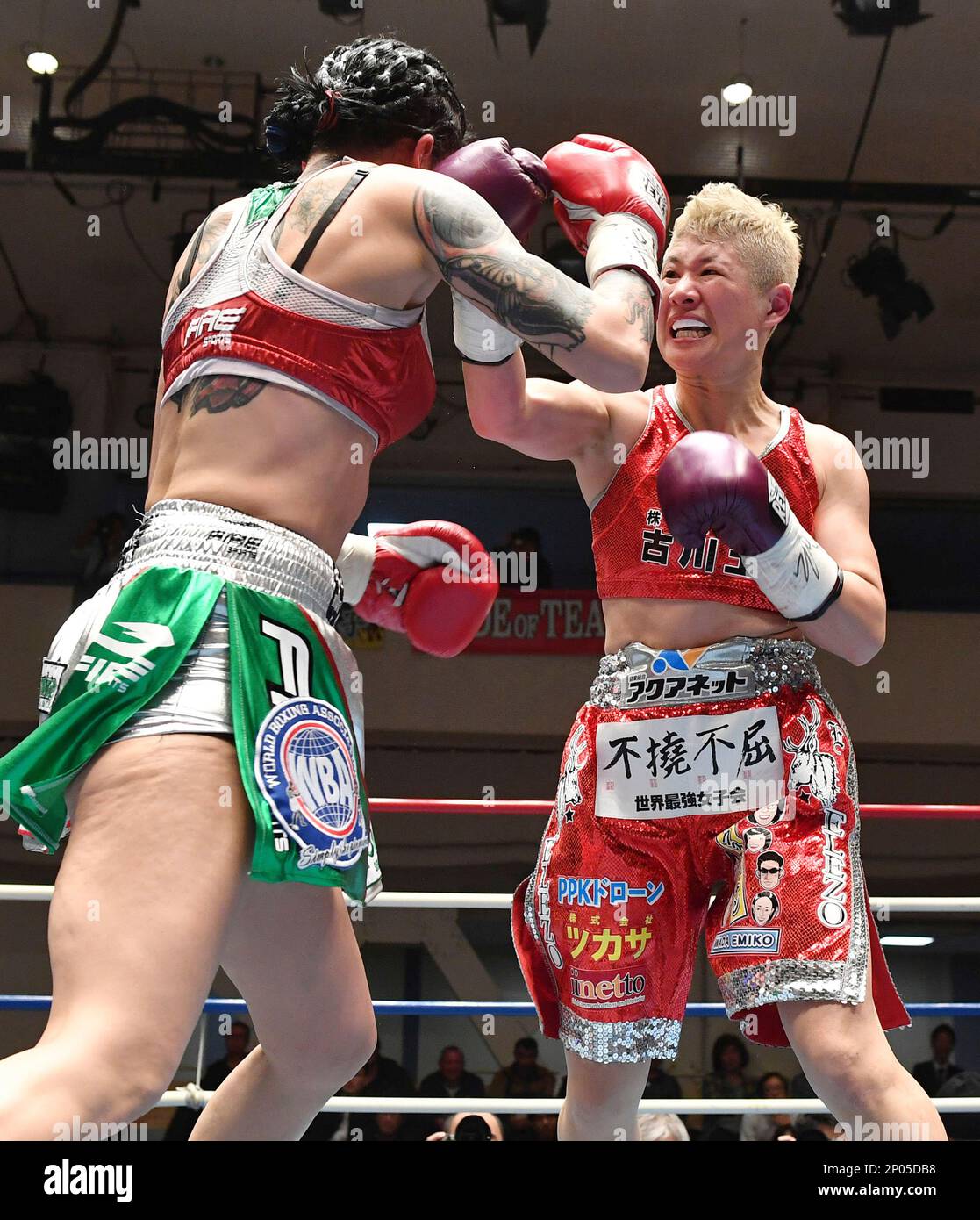Japan's Naoko Fujioka (R) lands a punch against Mexico's Isabel Millan ...