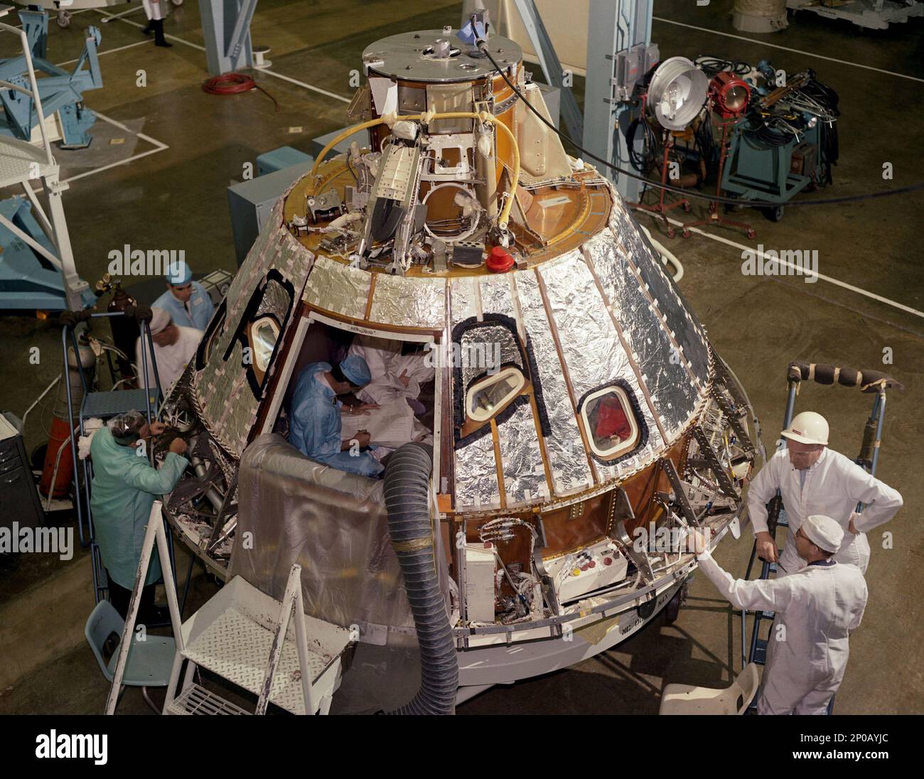 In this 1966 photo made available by NASA, technicians work on the ...