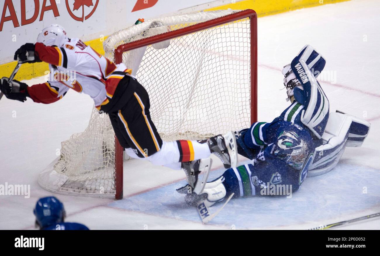 Calgary Flames defenseman Deryk Engelland (29) flies past Vancouver ...