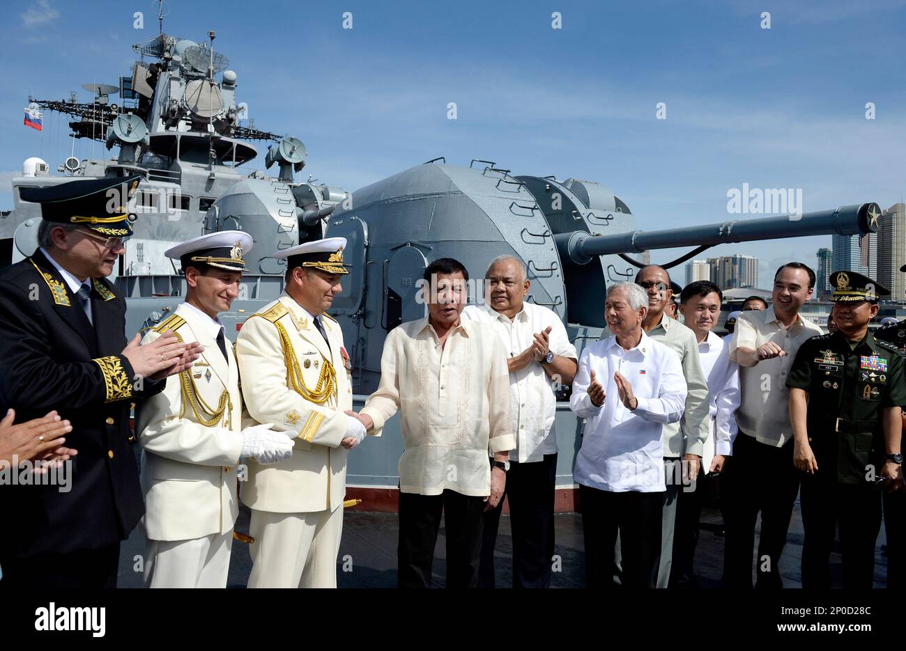 Philippine President Rodrigo Duterte, fourth left, shakes hands with ...