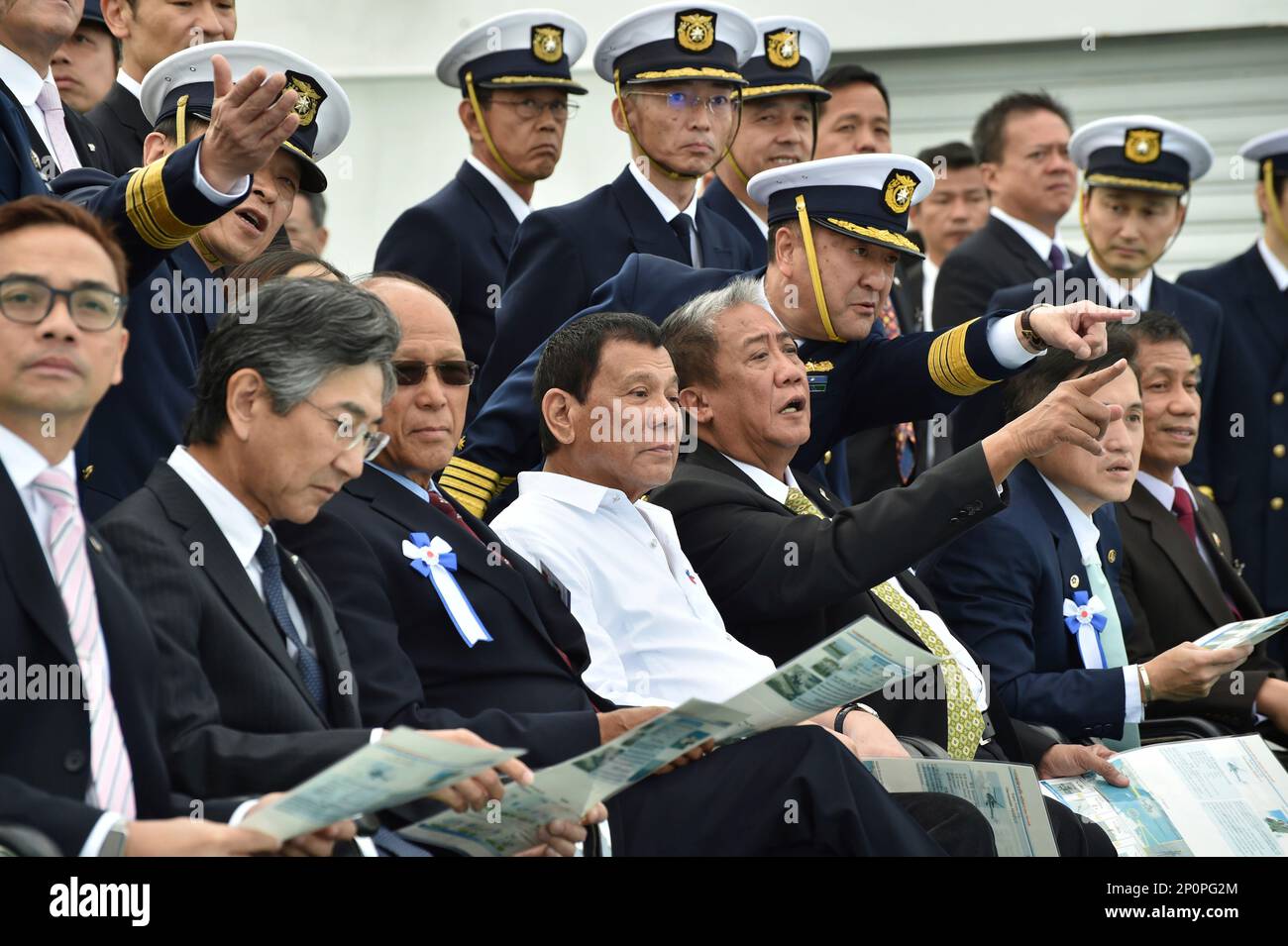 Philippine President Rodrigo Duterte, center, accompanied by ...