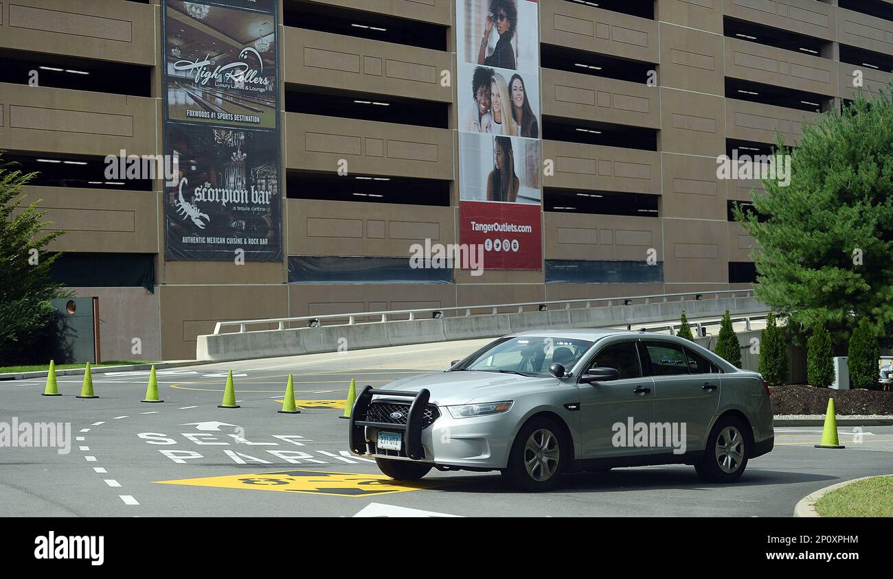 A Connecticut State Police cruiser departs the Fox Tower parking garage ...