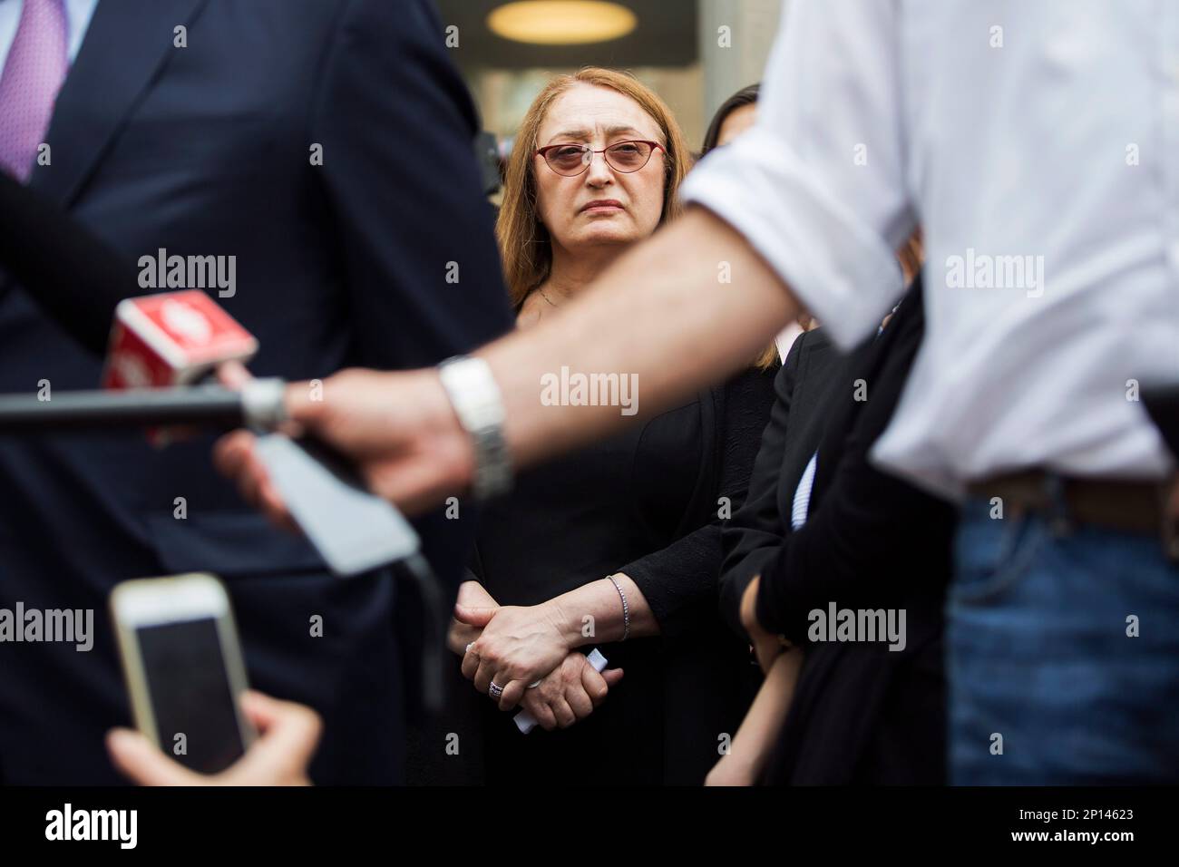 Sahar Bahadi, mother of Sammy Yatim, stands after speaking to the media ...