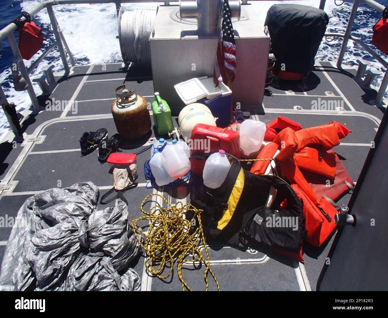 This photo made available by the U.S. Coast Guard shows personal items ...