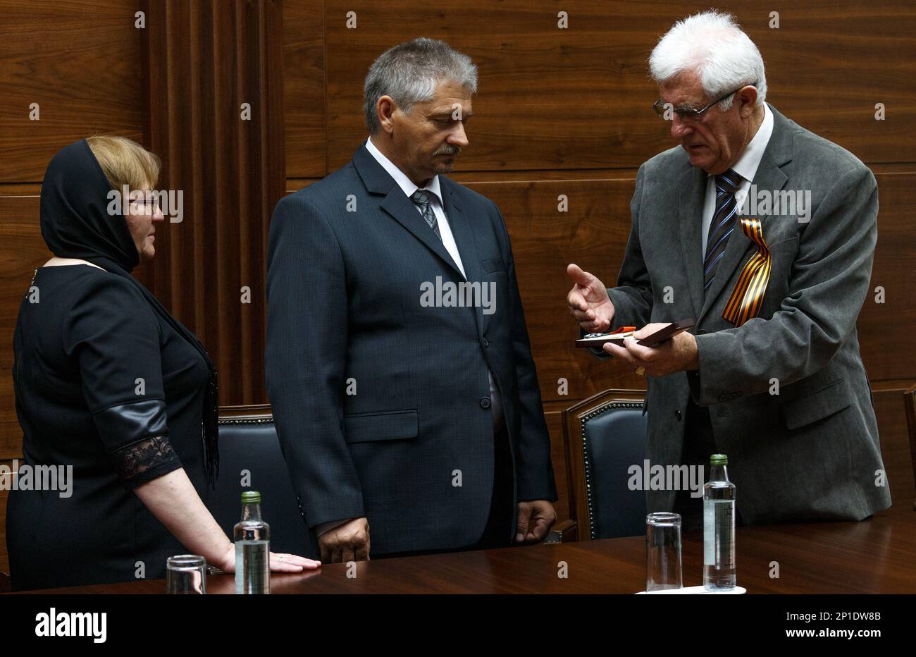 CAPTION CORRECTS THE NAME - Jean-Claude Mague, right, of France hands ...