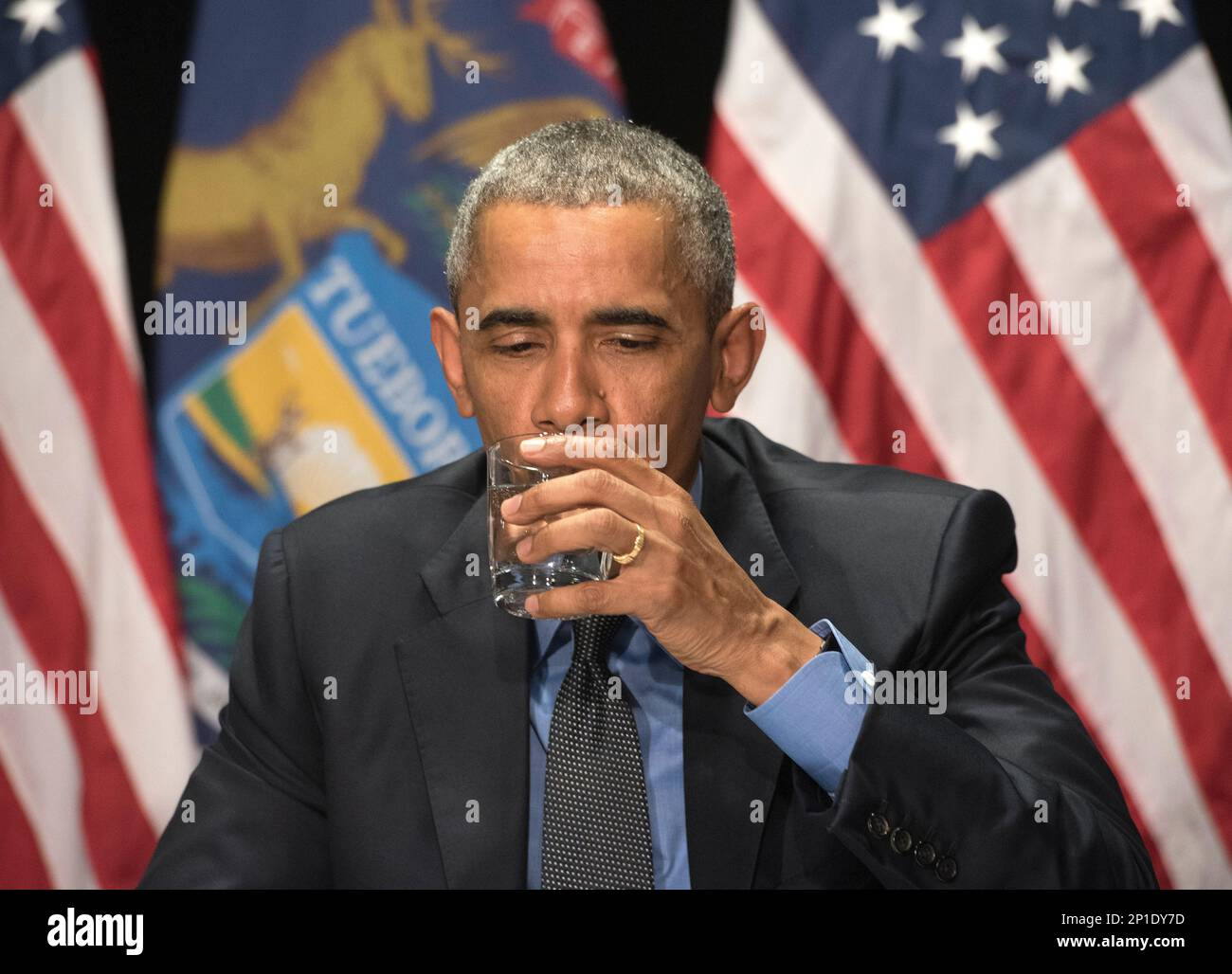 President Barack Obama drinks a glass of filtered Flint water during a meeting with Federal ...