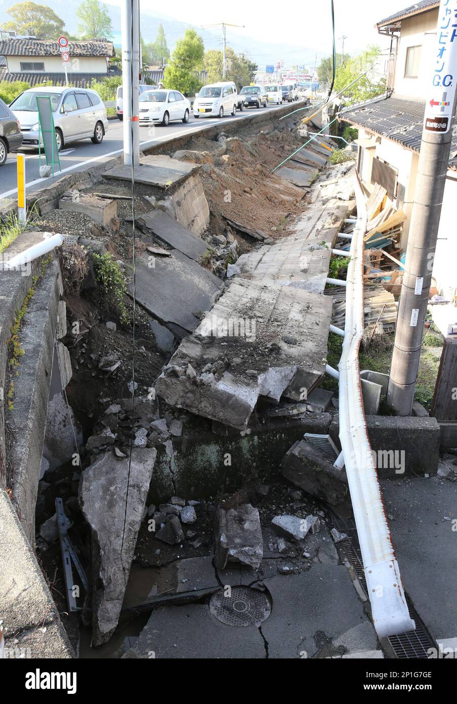 A photo shows the porthion of the road and crash barrier sinking in ...