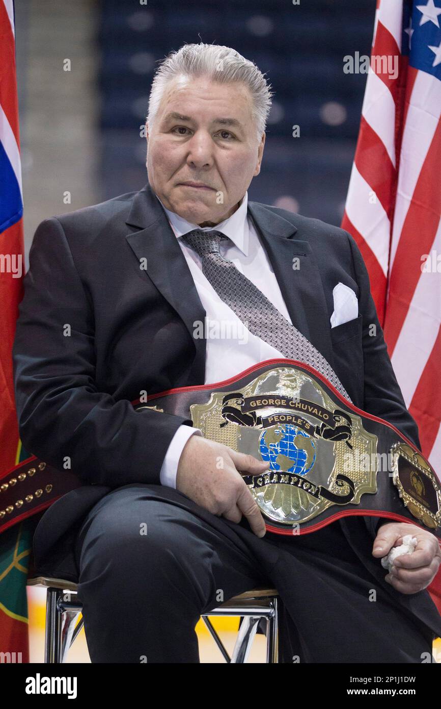 Former boxer George Chuvalo sits with an honorary "'People's Champion ...