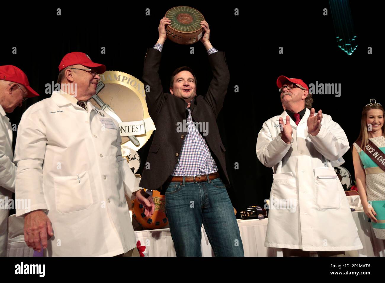 Tim Omer, president and managing director of Emmi Roth USA, hoists a ...