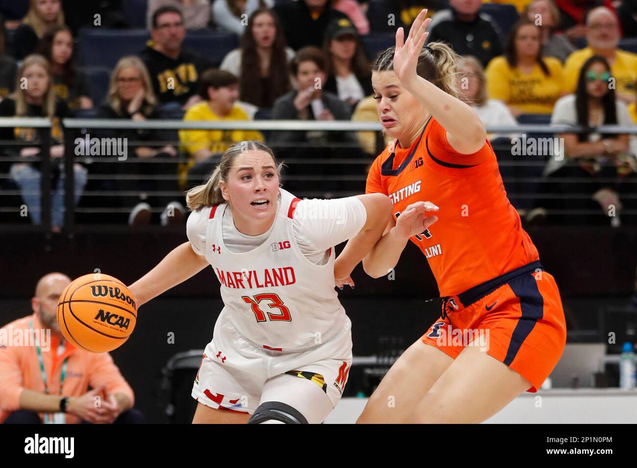 Maryland guard Faith Masonius (13) works around Illinois forward ...