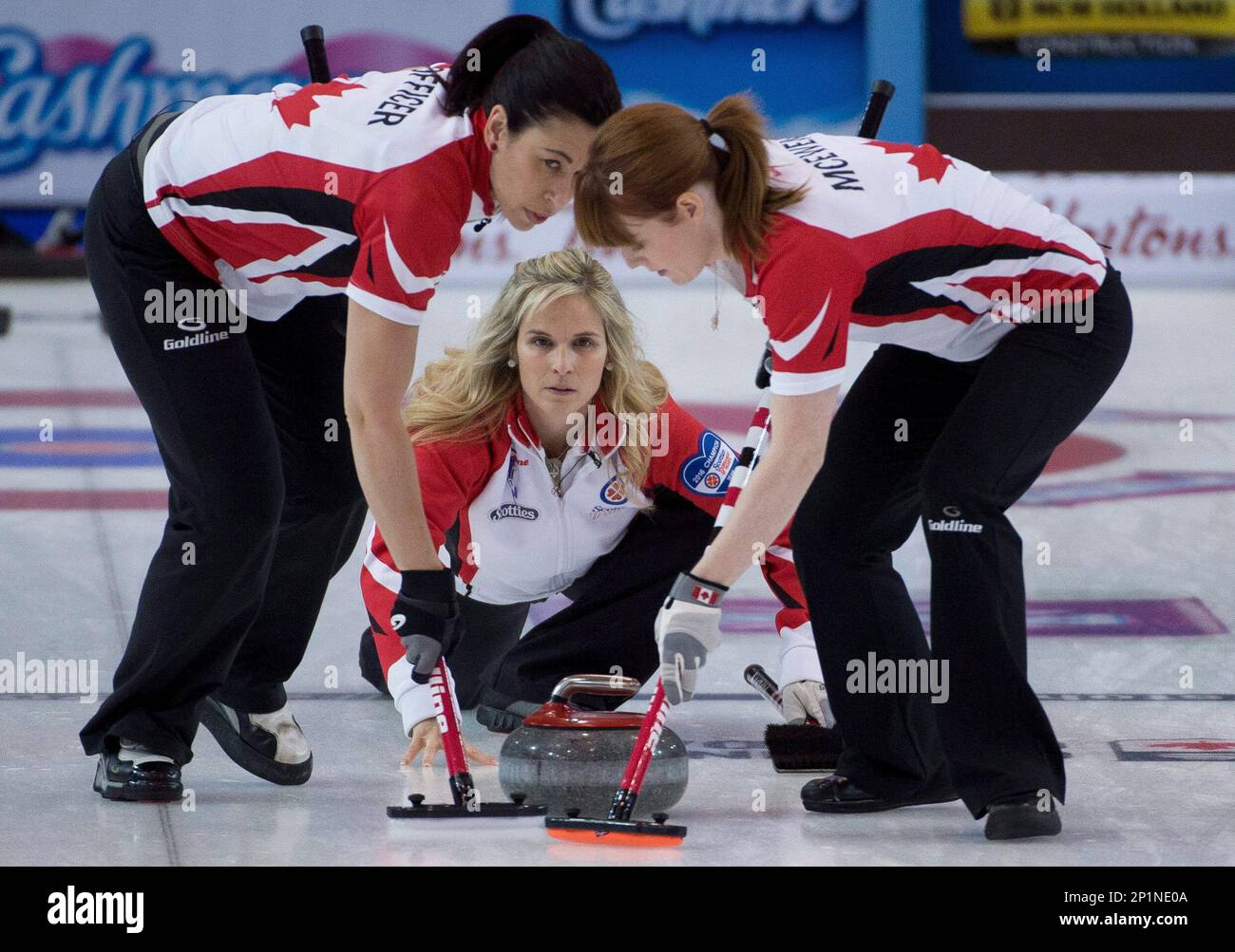 Team Canada skip Jennifer Jones, center, makes a shot as second Jill ...