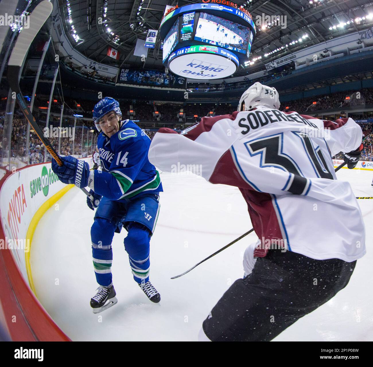 Vancouver Canucks' Alex Burrows, left, and Colorado Avalanche's Carl ...