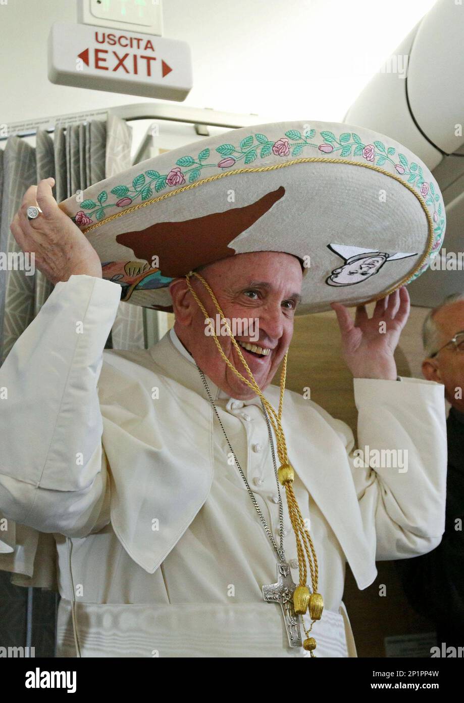 Pope Francis wears a traditional Mexican sombrero hat he received as a ...