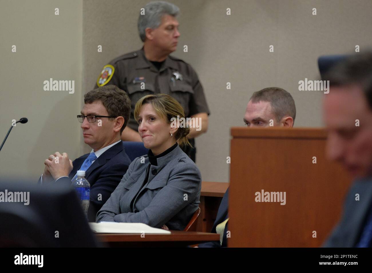 Defense attorney Megan Thomas, seated between Joe King, left, and Chris ...