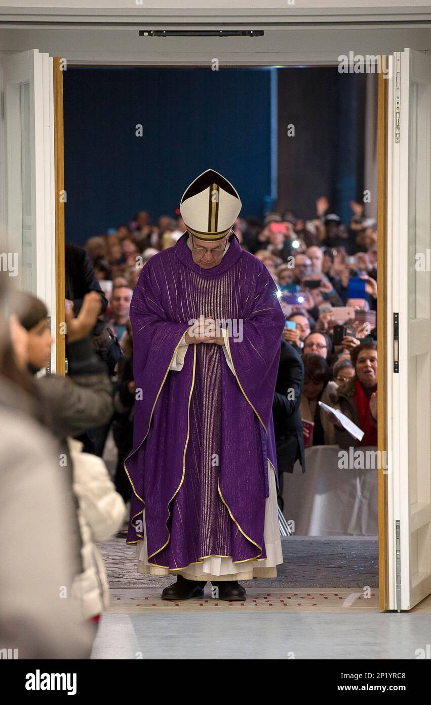 Pope Francis performs the rite of opening the Holy Door at a charity ...