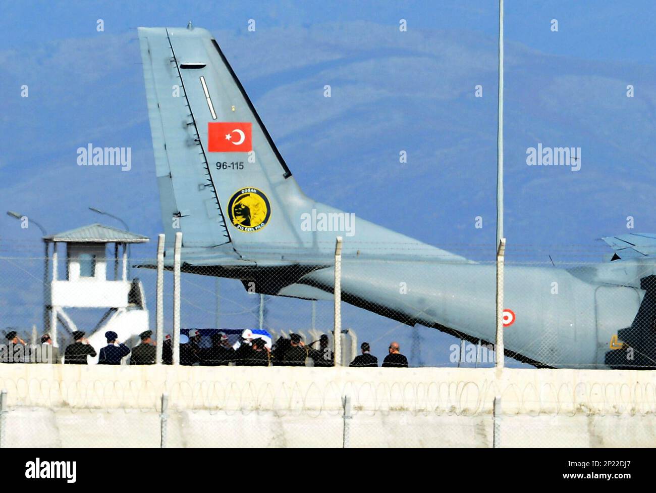 Turkish army officers salute as Turkish honour guard carry the coffin ...