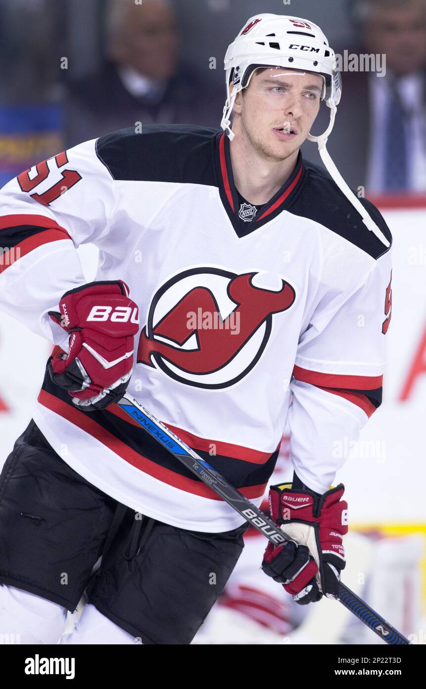 NHL player profile photo on New Jersey Devils' Sergey Kalinin, from Russia, at a game against ...