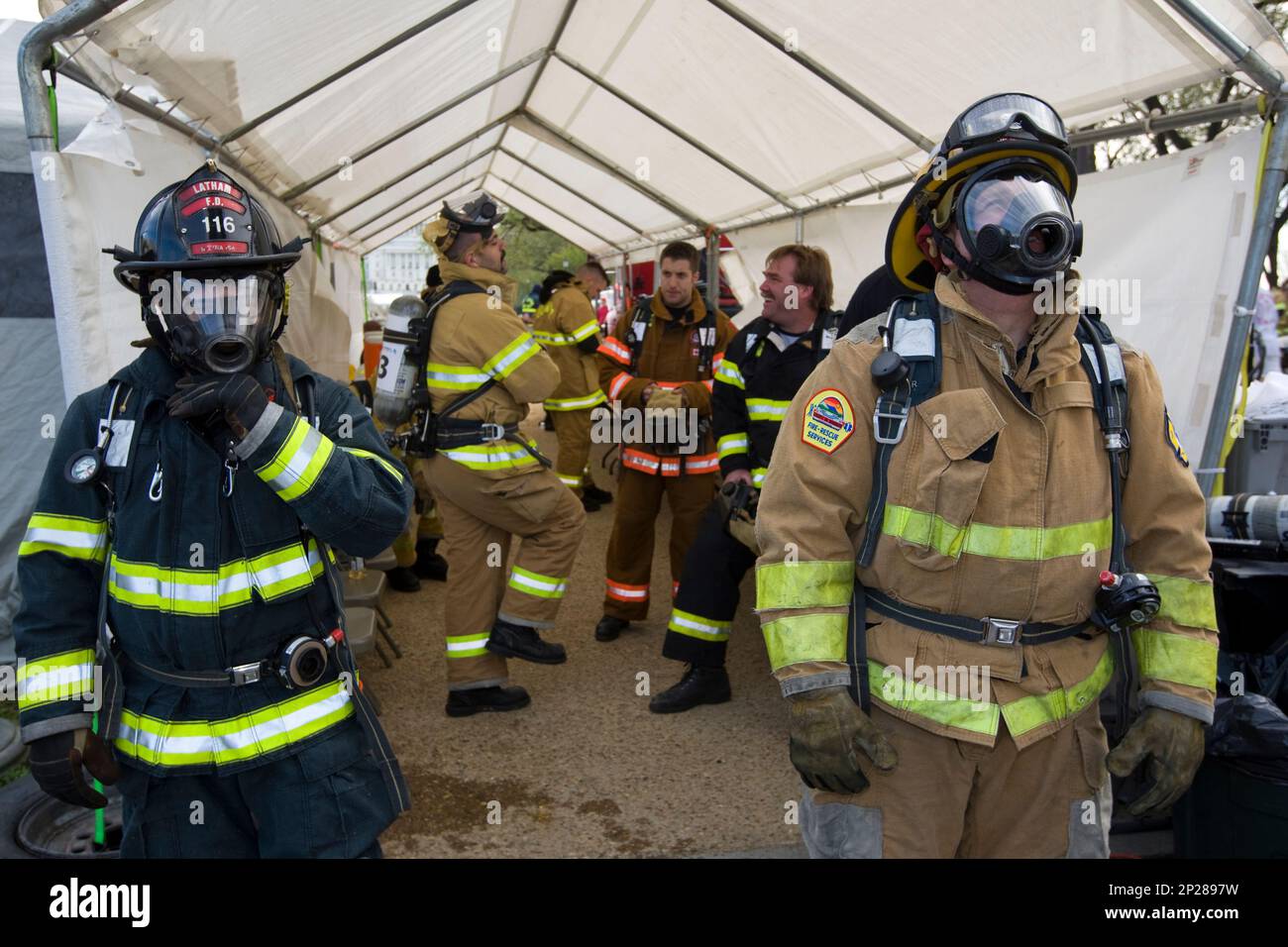 Firefighters wait their turn during the Firefighter Combat Challenge ...