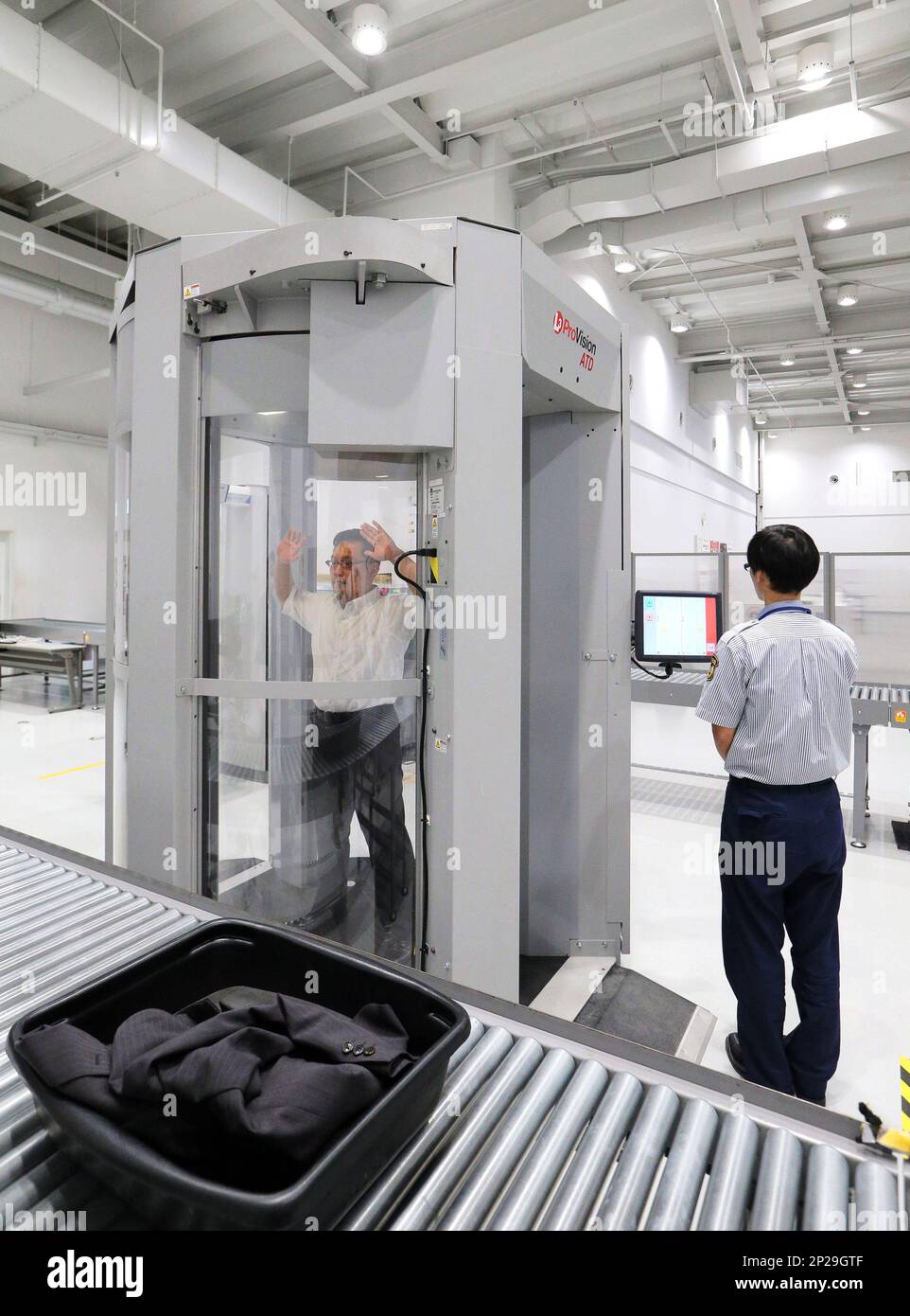 A “full-body scanner” is shown to media on at Terminal 2 of Kansai ...