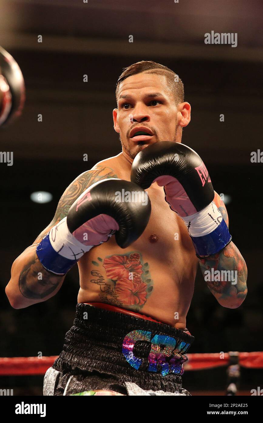 Orlando "El Fenomeno" Cruz (R) punches Gabino "Flash" Cota during their ...