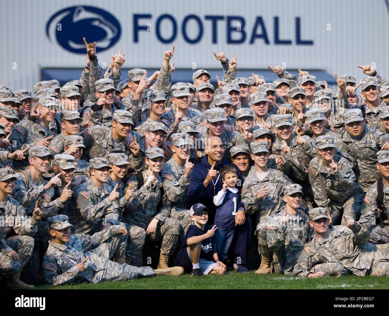 Penn State head coach James Franklin poses for a photo with members of ...