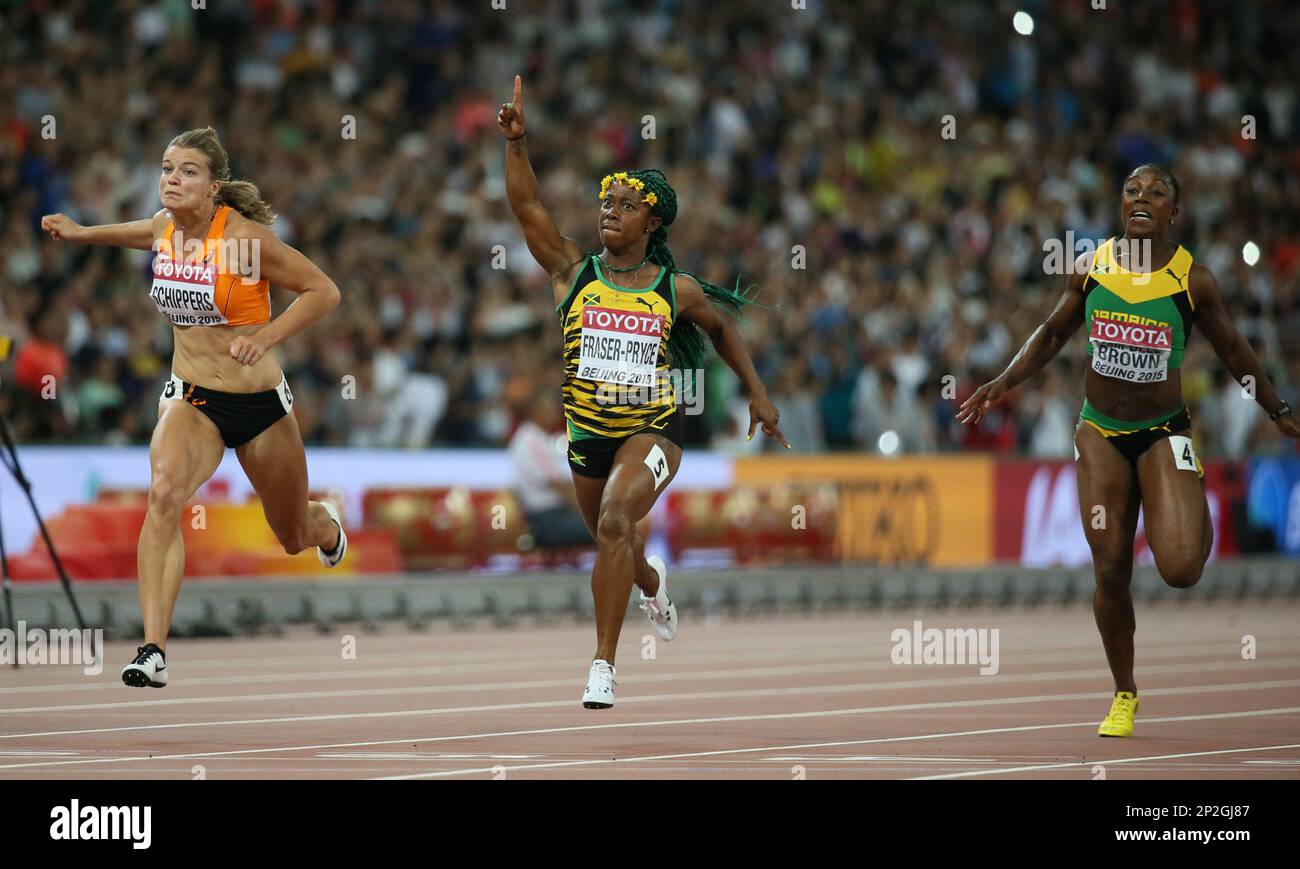 Jamaica's Shelly-Ann Fraser-Pryce (C) wins the women's 100-meter final at the World Athletics ...