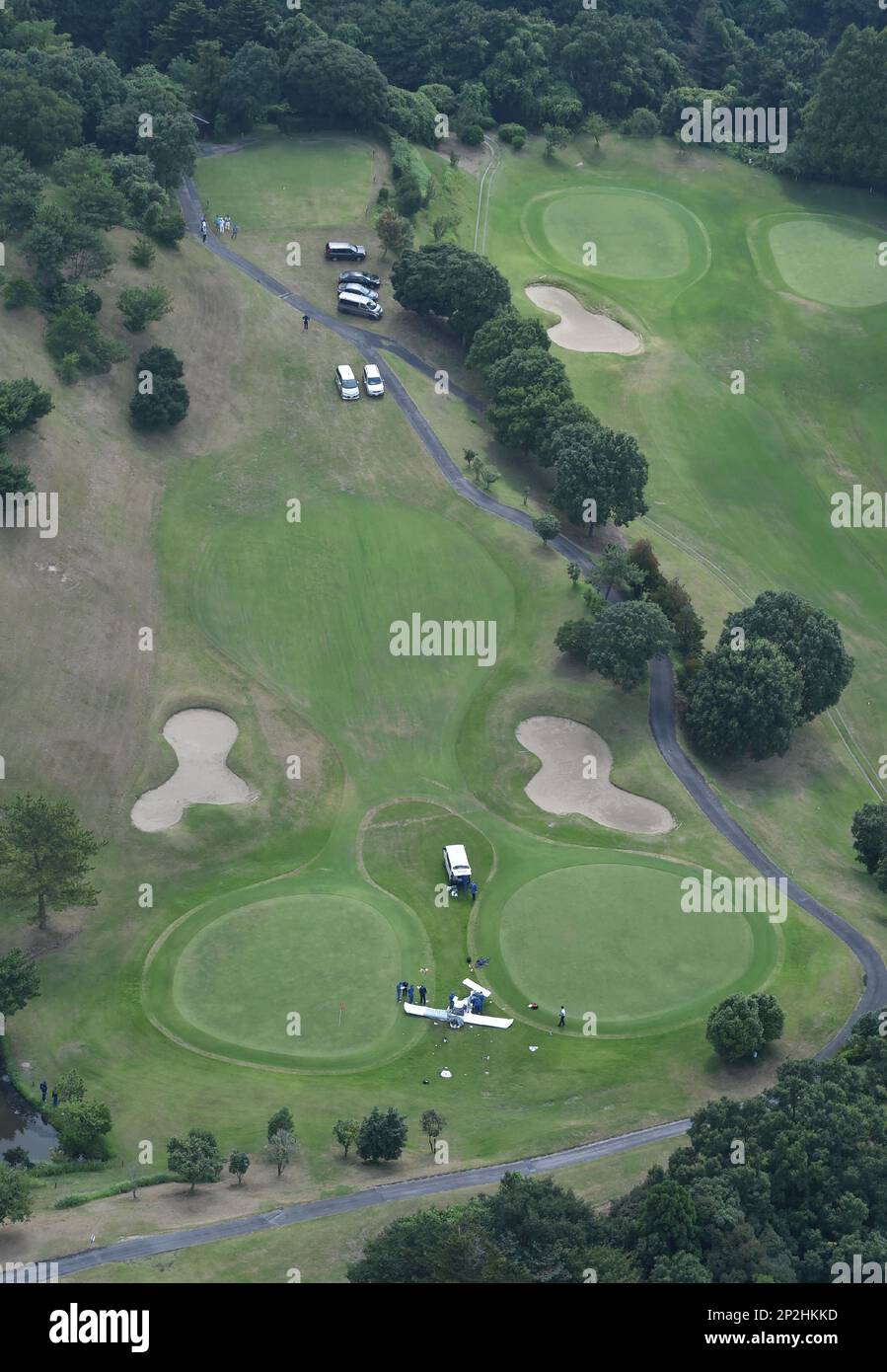 An aerial picture shows police offiers investigating into an ultralight ...