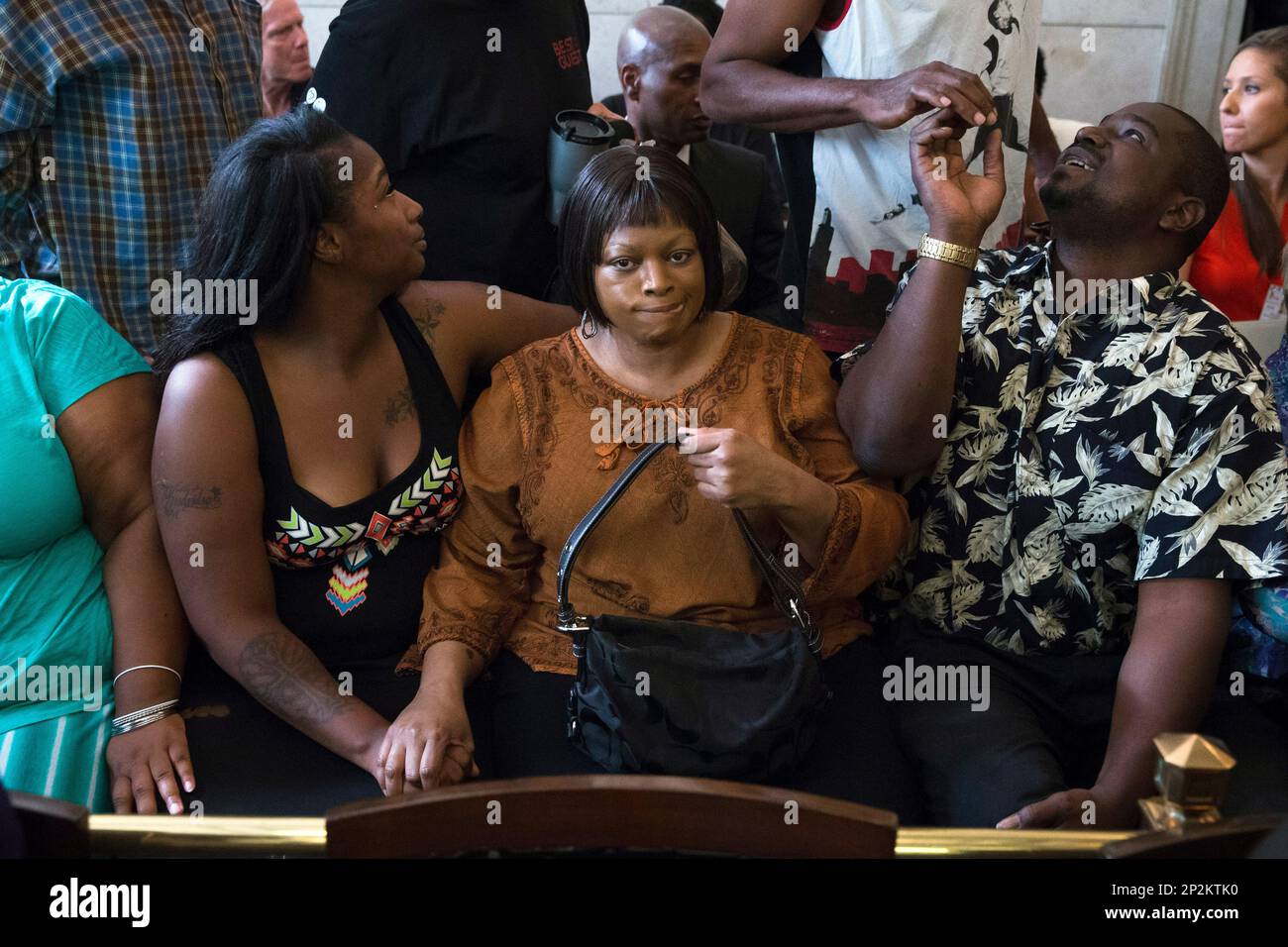 Terina Allen, sister of Samuel DuBose, sits with family members as she ...