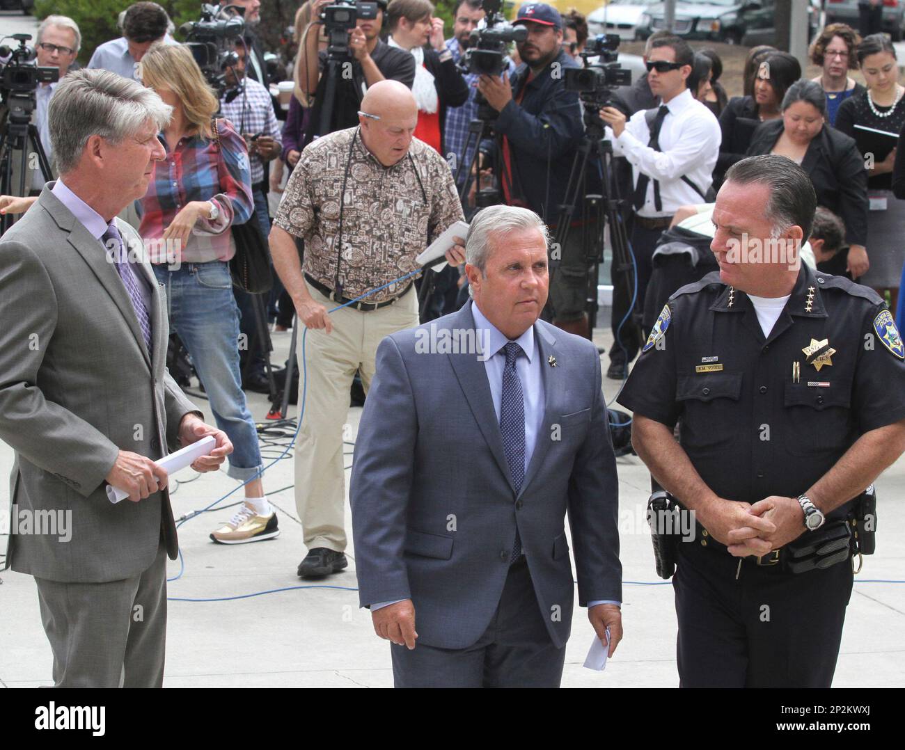 Santa Cruz County District Attorney Jeff Rosell, center, is flanked by ...