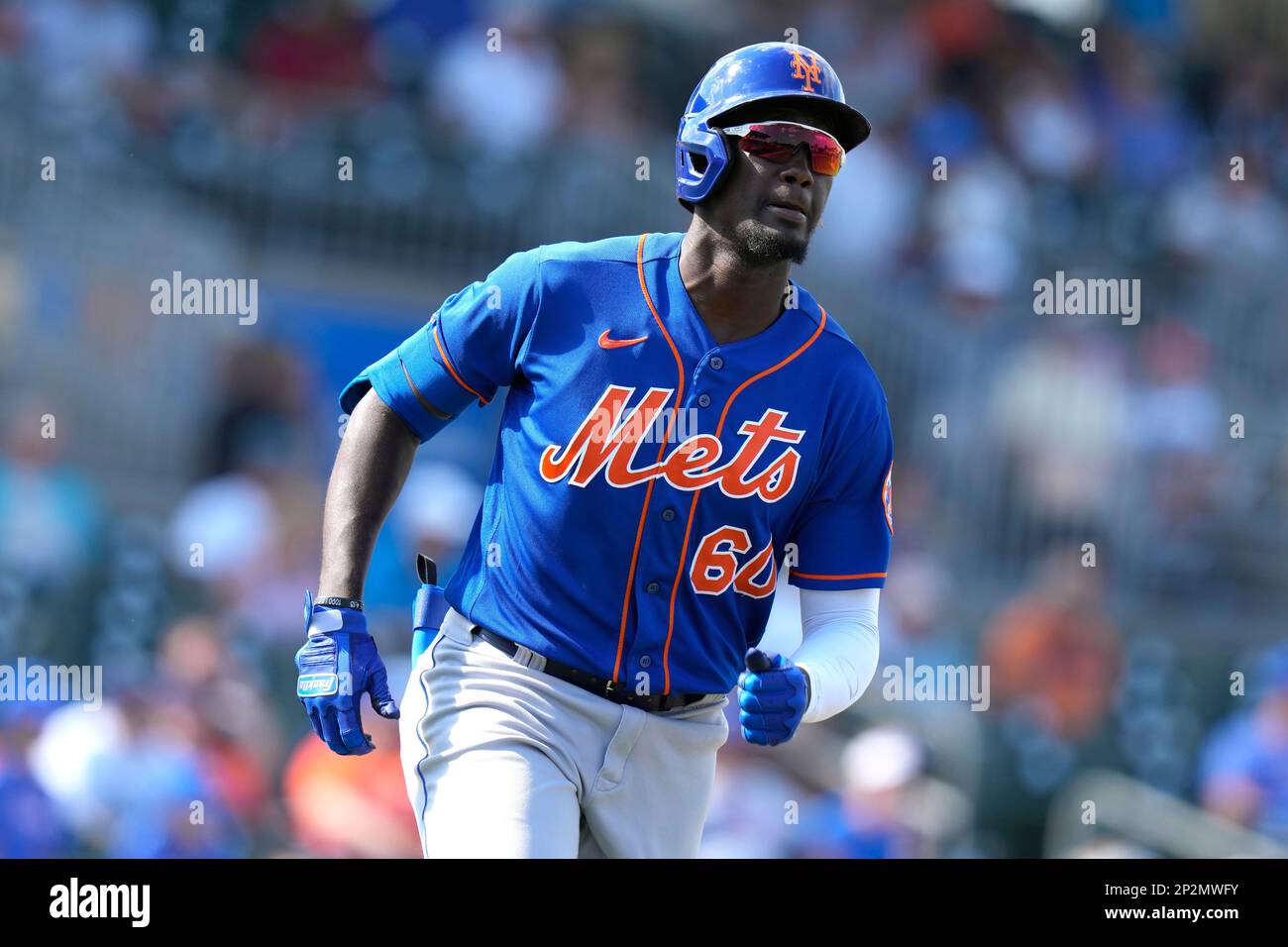 New York Mets' Ronny Mauricio runs to first with a single during the of ...