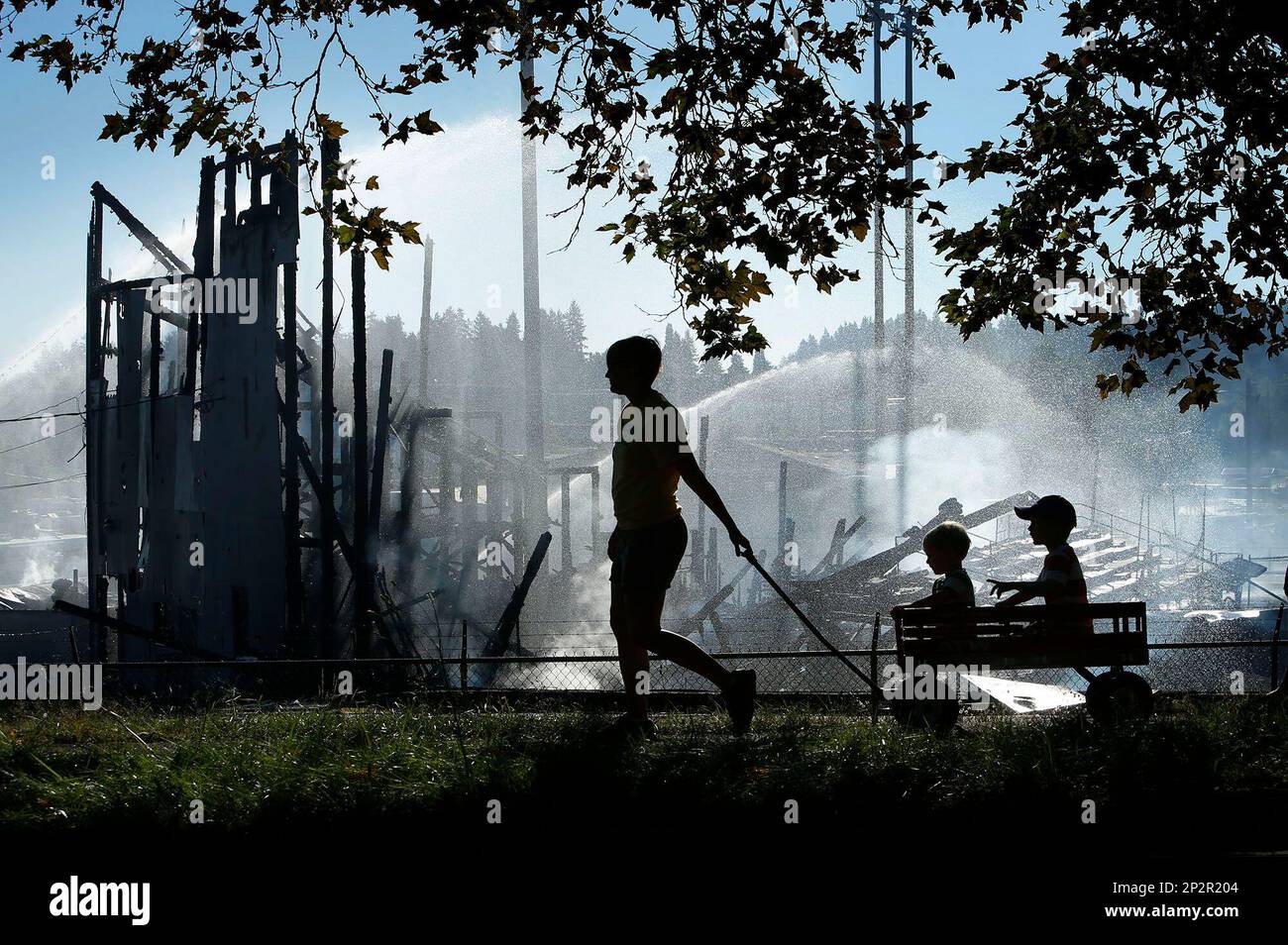 Beth Wirth, left, pulls her sons Emmett Wirth, 2, and Anderson Wirth, 5 ...