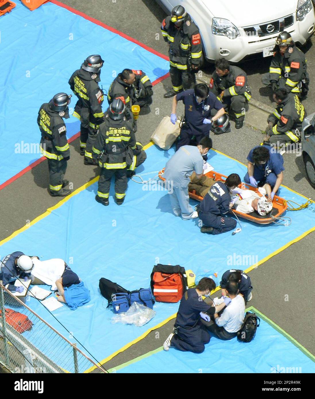 Passengers of a Shinkansen bullet train which made an emergency stop ...
