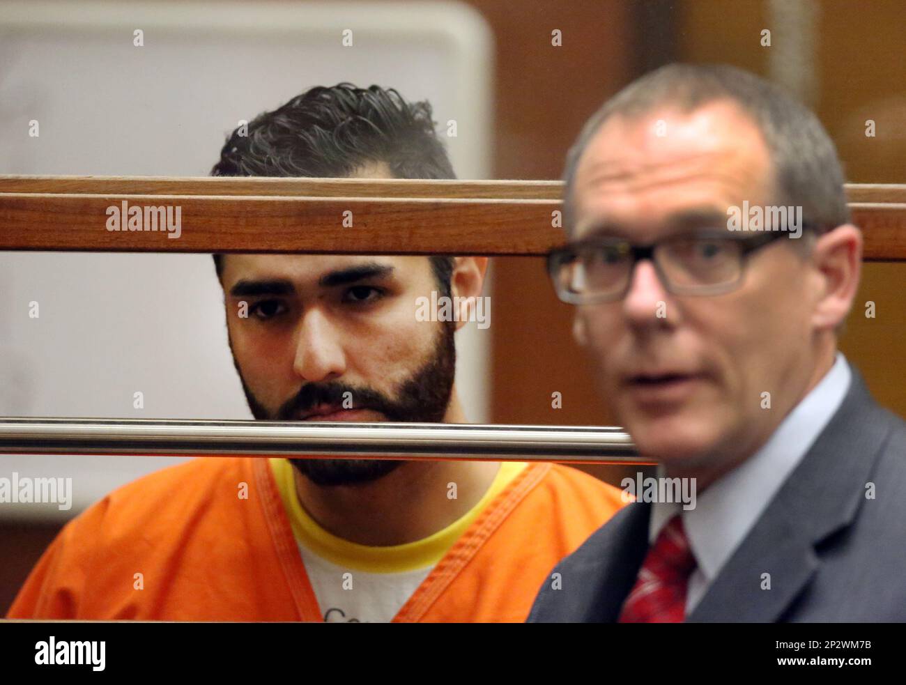 Henry Solis, a former Los Angeles police officer, left, appears with ...
