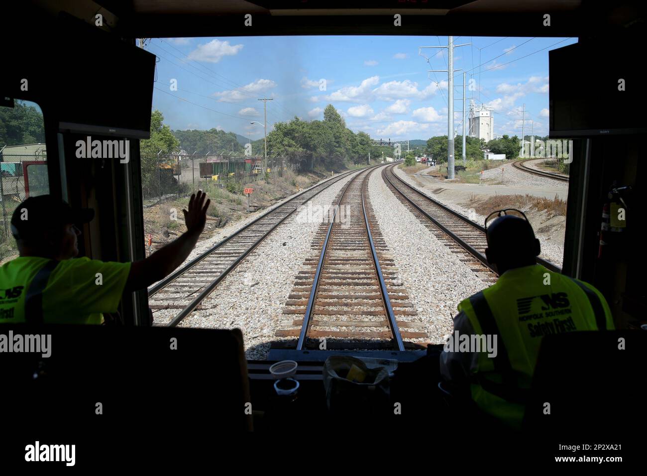 Norfolk Southern crew members seated in the observatory car at the end ...